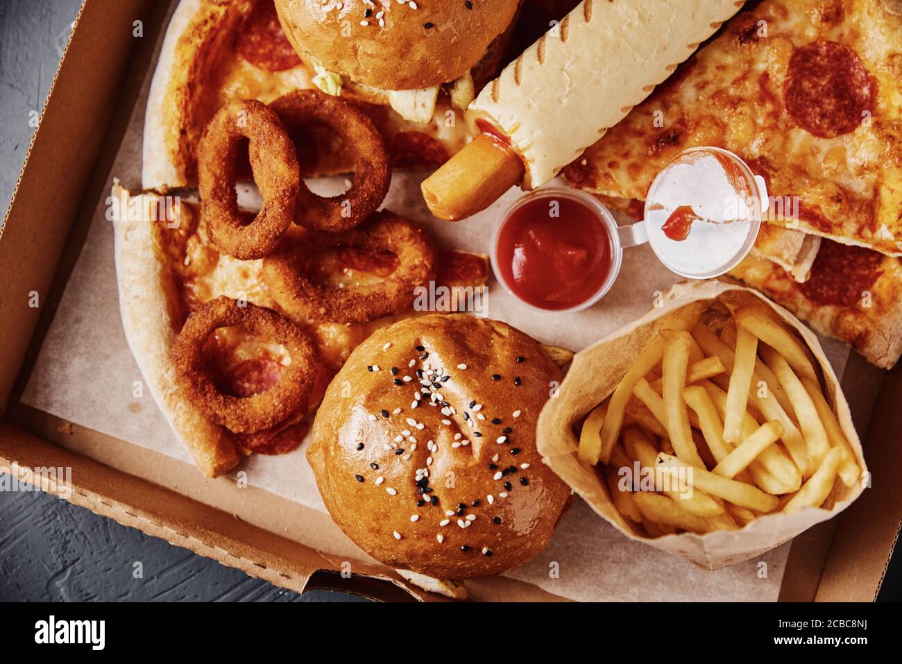 Unhealthy and junk food. Different types of fast food on the table ...