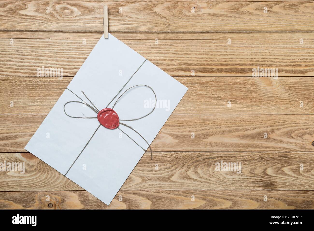 Mail envelope on rope Stock Photo - Alamy