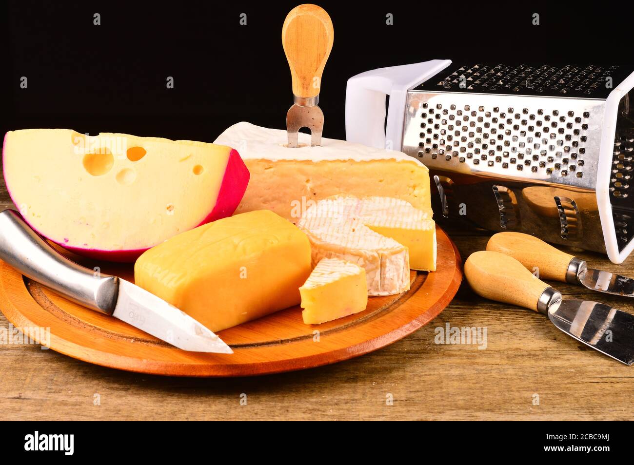 Table of mixed cheese on a studio shot Stock Photo - Alamy