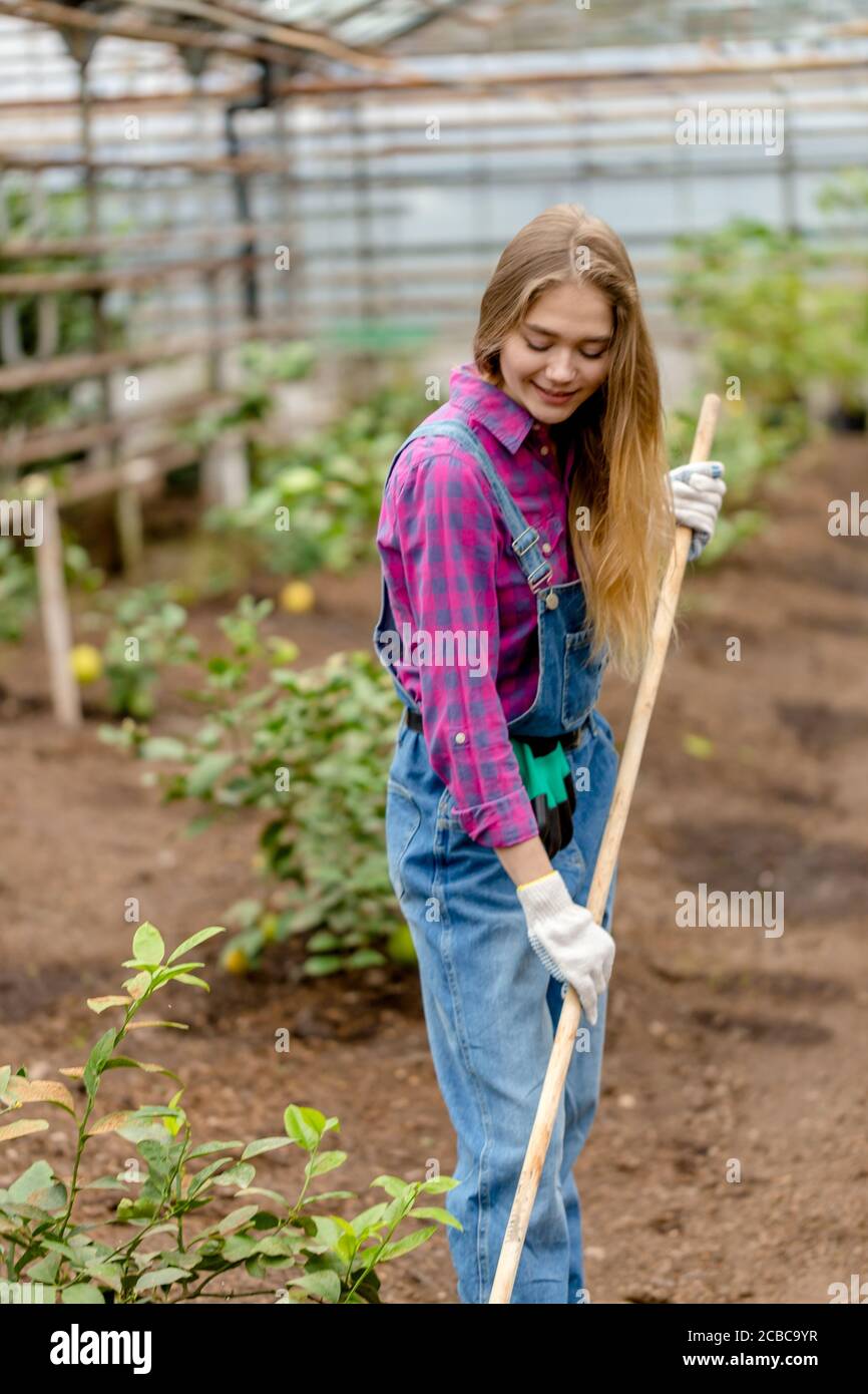 Woman with a hoe hi-res stock photography and images - Alamy