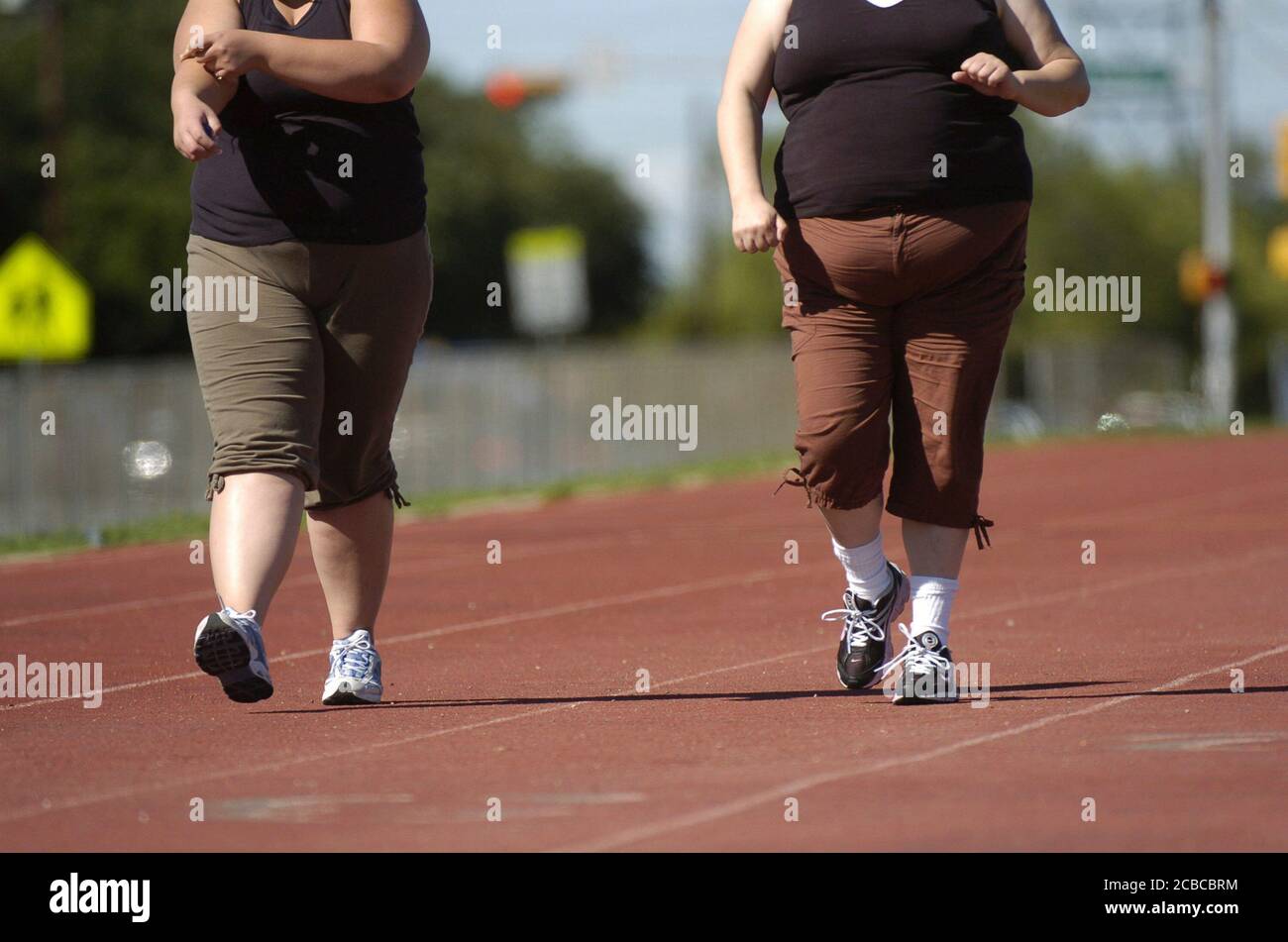 Two fat women walking on hi-res stock photography and images - Alamy