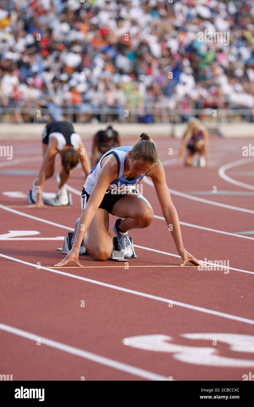 Austin, Texas USA, May 10, 2008: A female runner anticipates the start ...