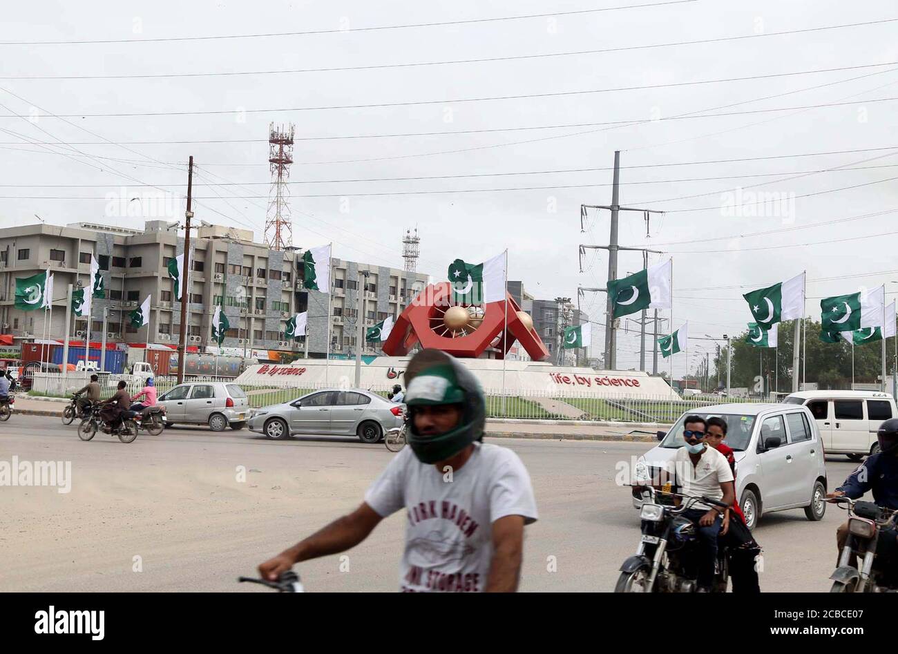 Beautiful view of Brooks Chowrangi decorated with National Flags in ...