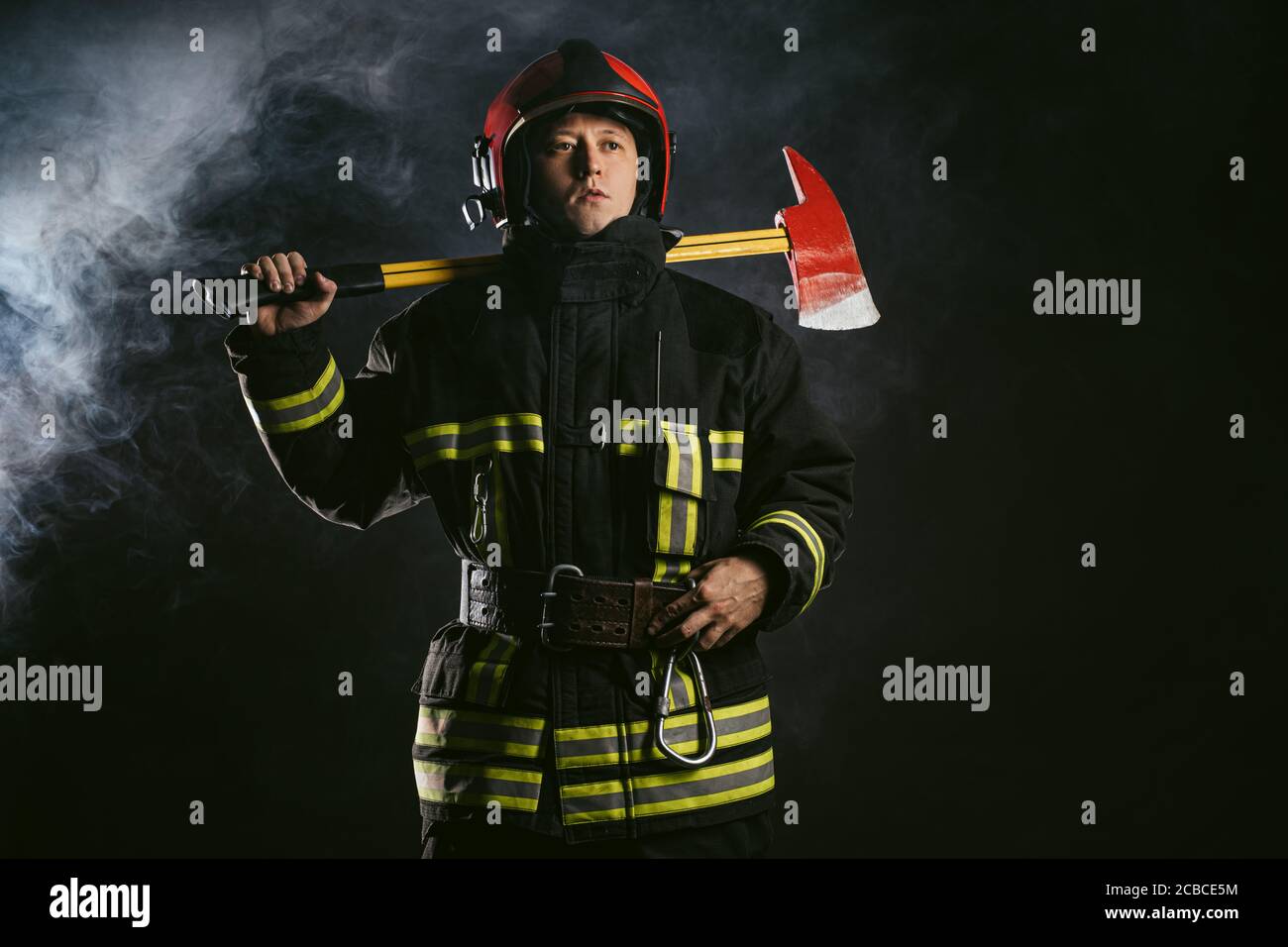reverent, confident man working in fire station ready to save people ...