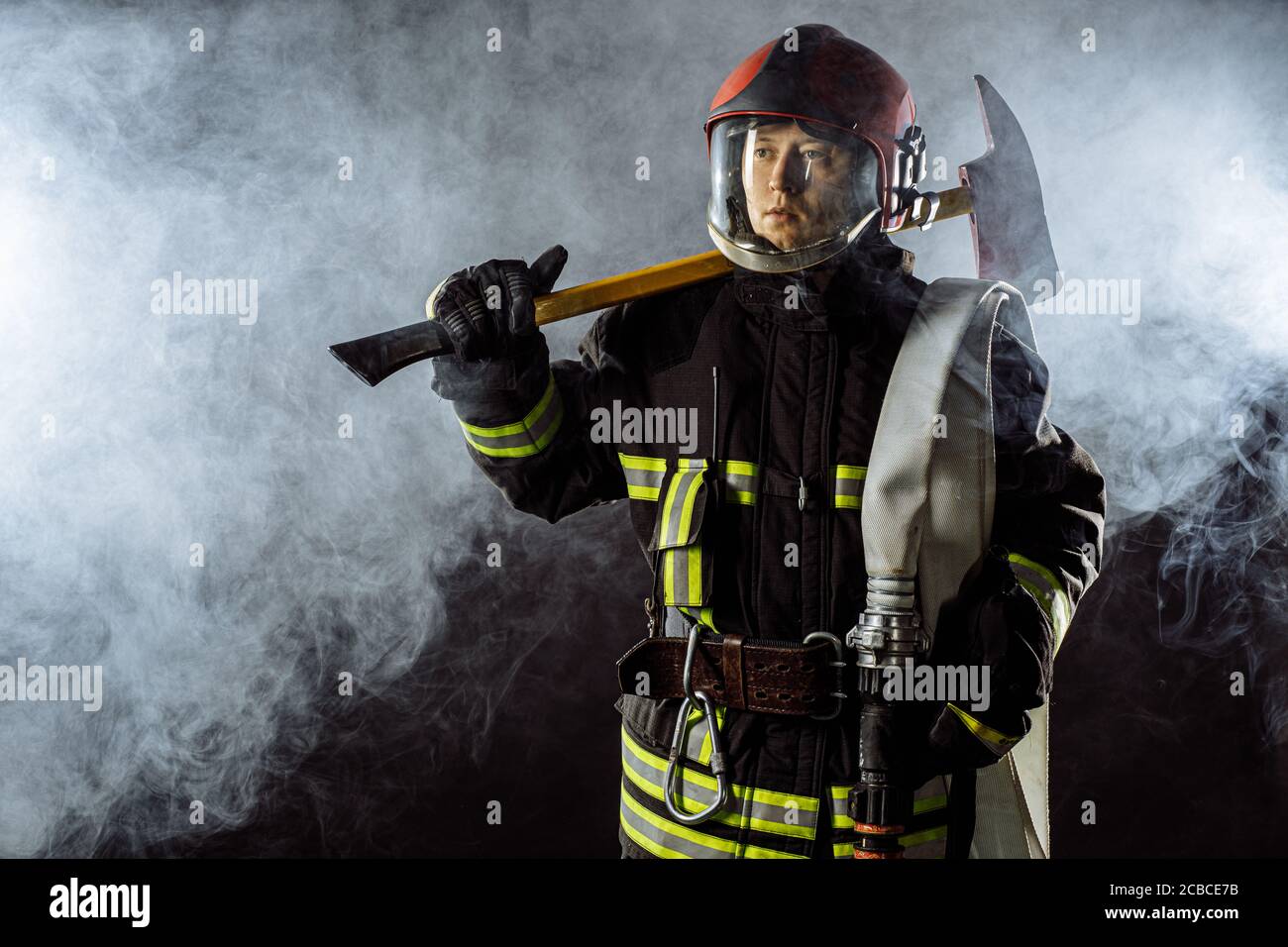 Young man fire extinguisher fire hi-res stock photography and images ...