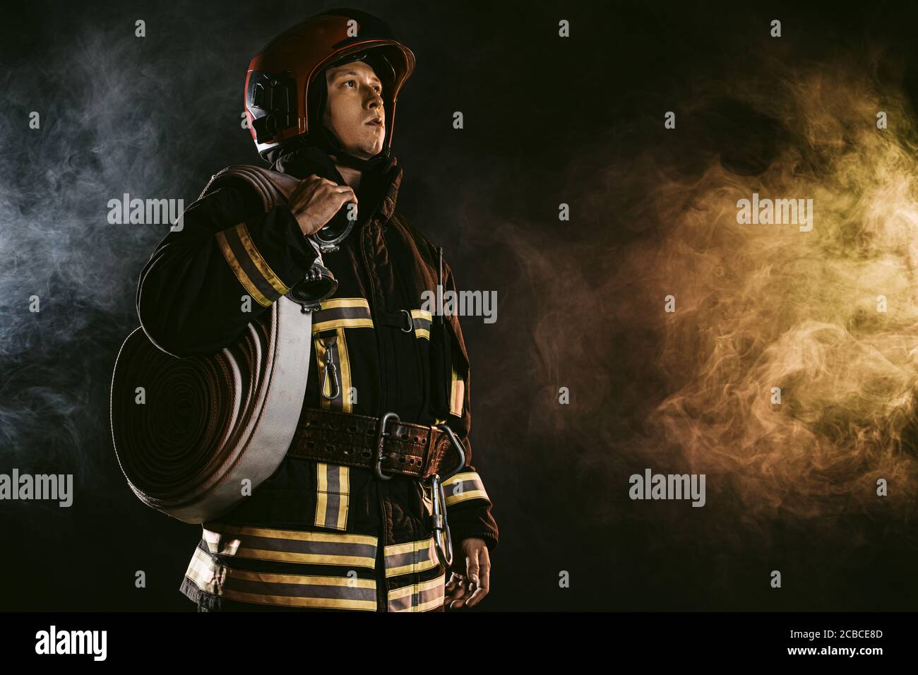brave man fire fighter extinguishing fire, work at fire station and ...