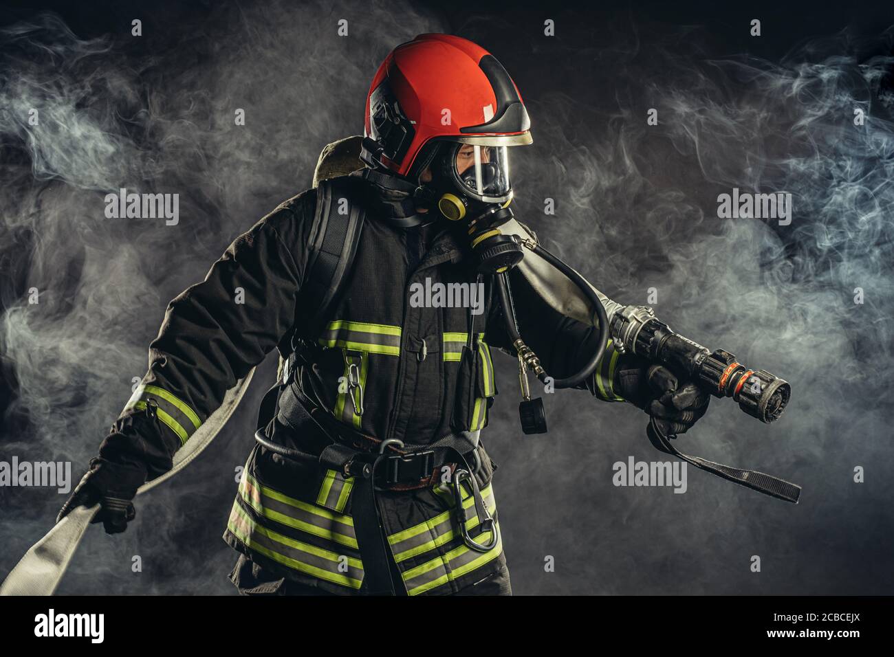 Man using fire extinguisher hi-res stock photography and images - Alamy