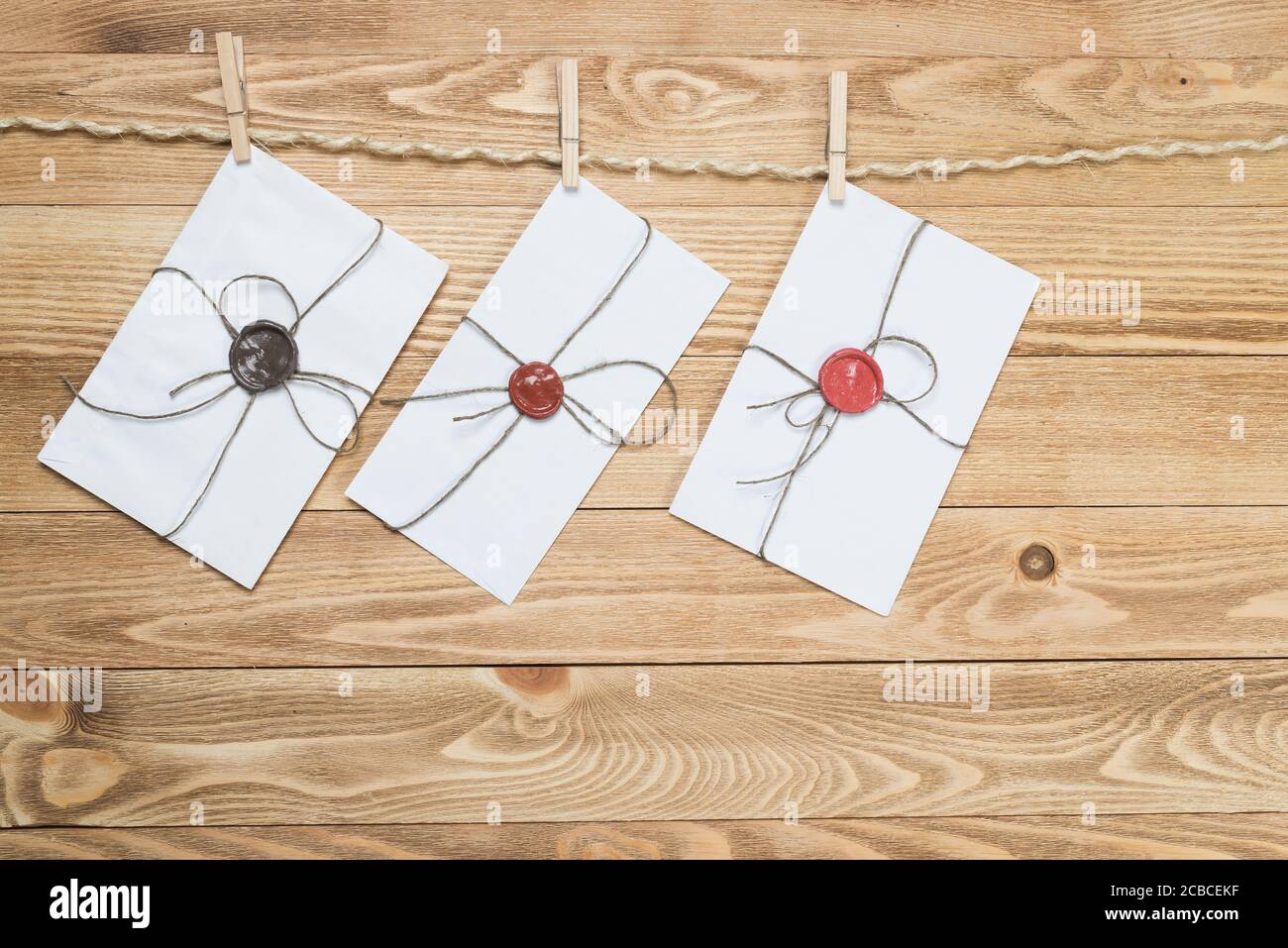 Mail envelope on rope Stock Photo - Alamy