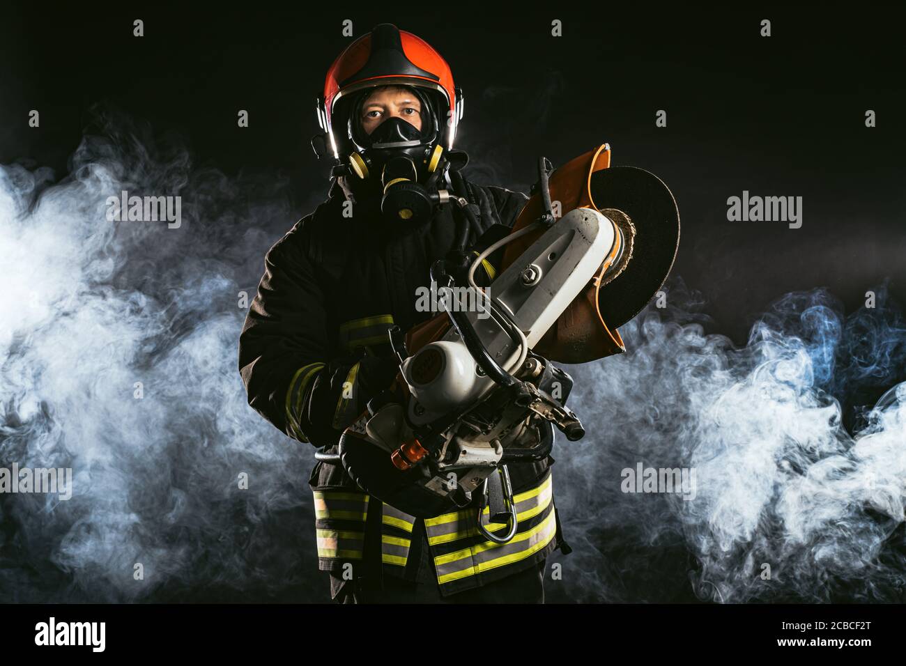 fireman or firefighter stand in smoke, professional worker of fire ...