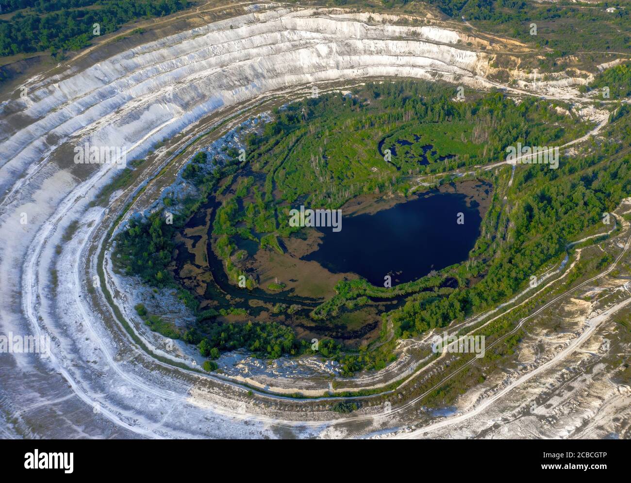 Old open-cast mine. Industrial extraction of chalk and by mining. Lake ...
