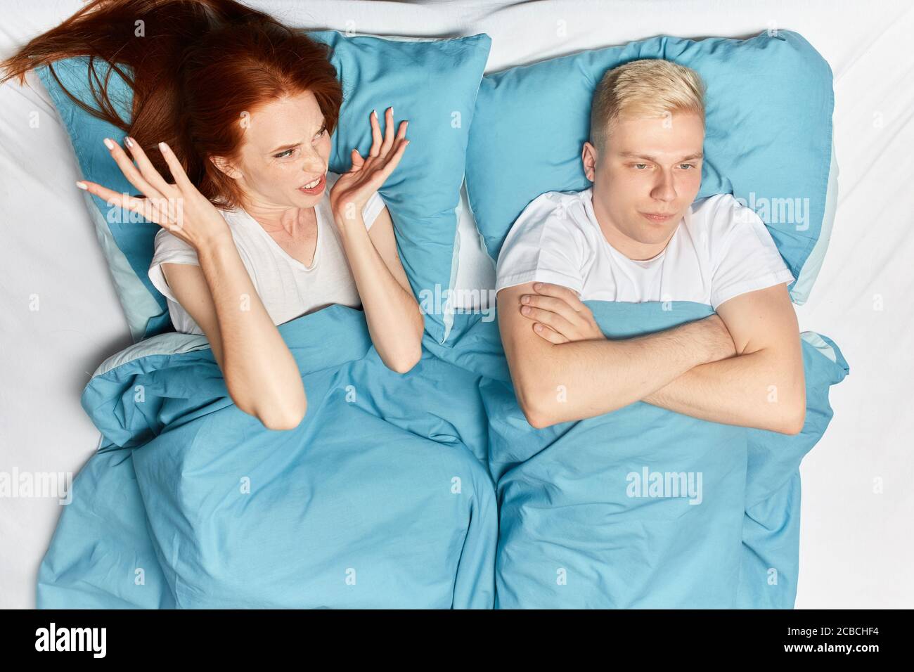 young man and woman having conflict, problem, aggressive woman screams ...