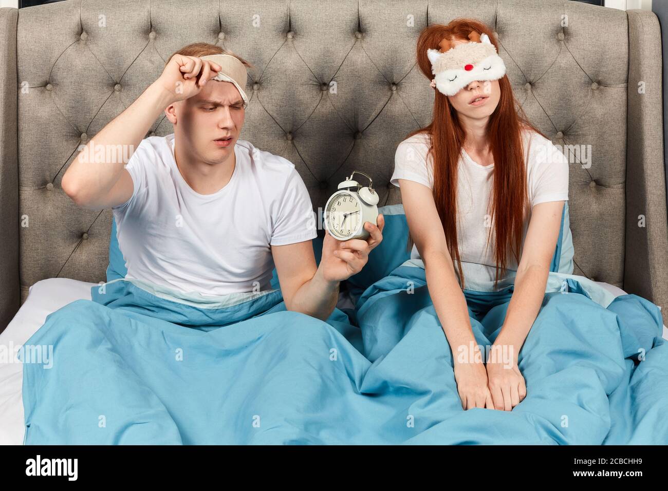 Woman in sleep mask alarm clock hi-res stock photography and images - Alamy