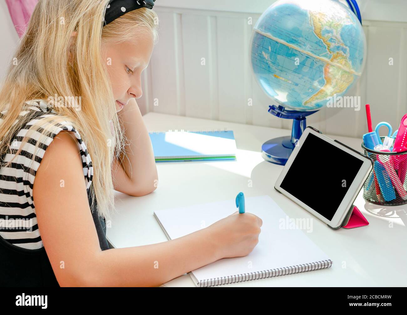 Home schooling concept. Caucasian girl learning online, doing her ...