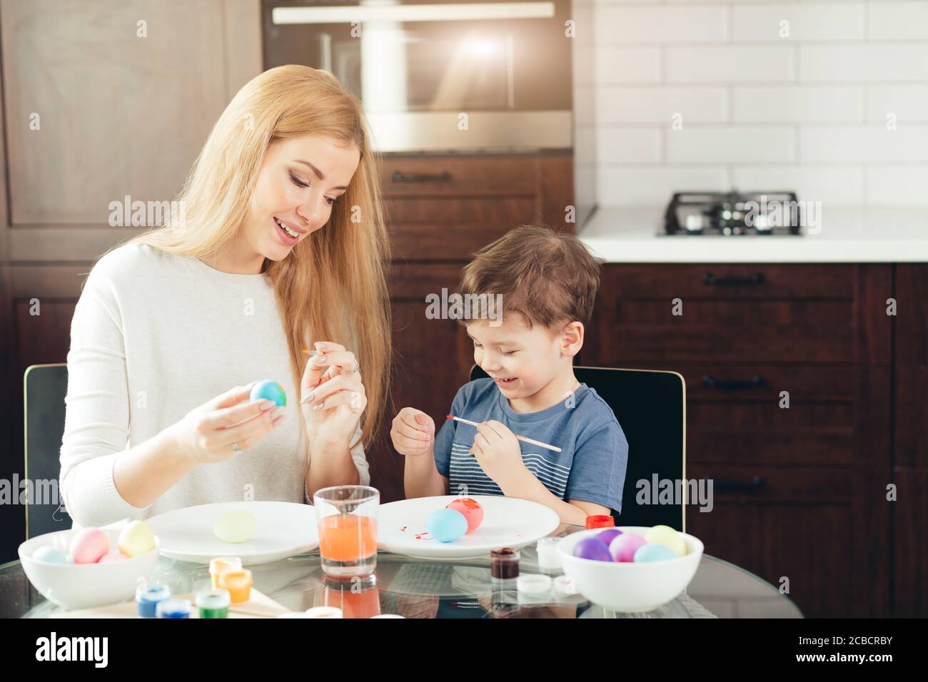 In Handcraft workshop for families, woman and male child. Learning new ...