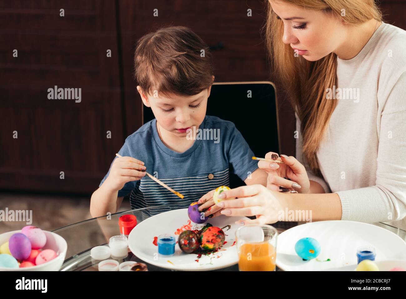 In Handcraft workshop for families, woman and male child. Learning new ...