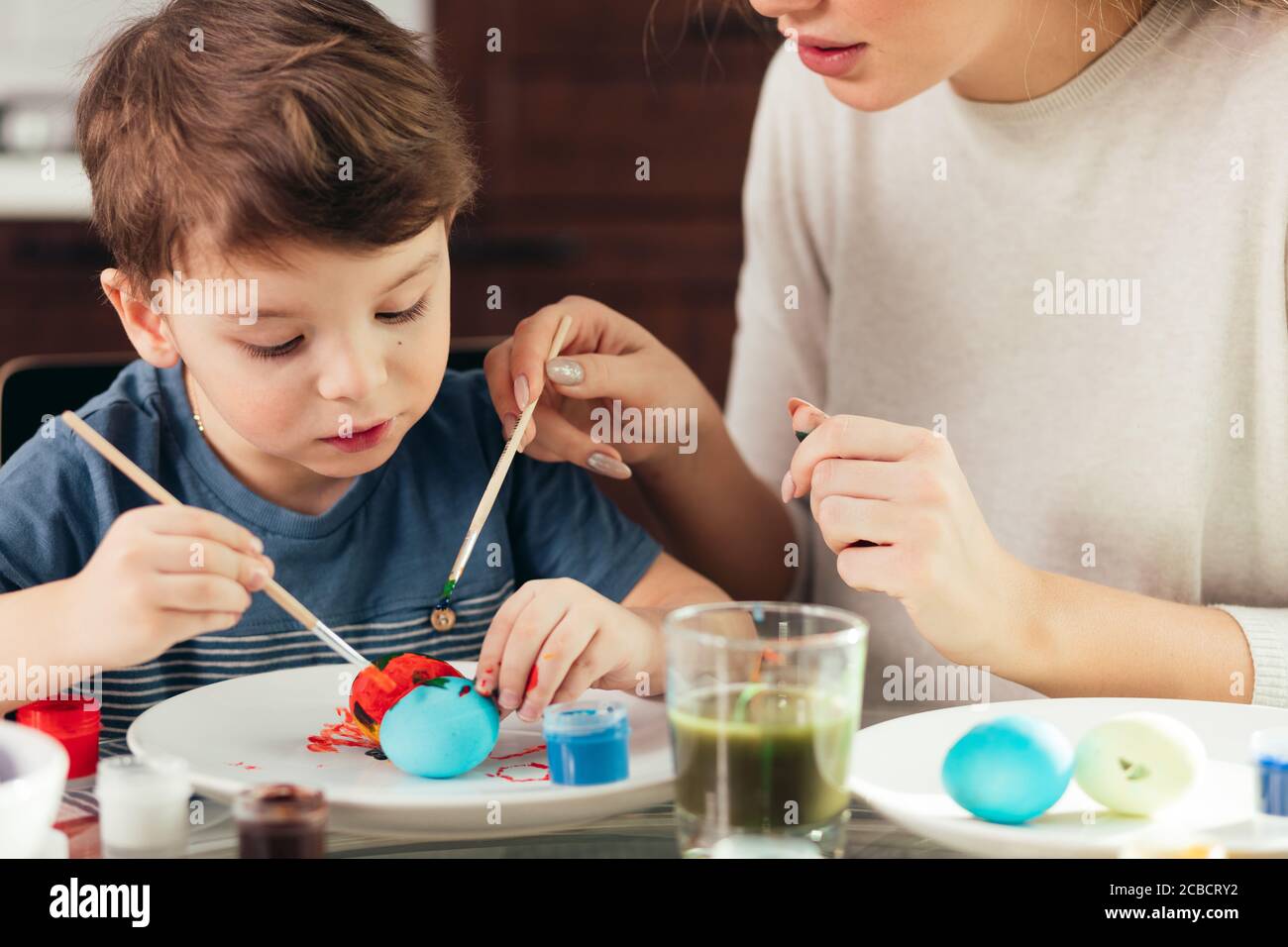 In Handcraft workshop for families, woman and male child. Learning new ...