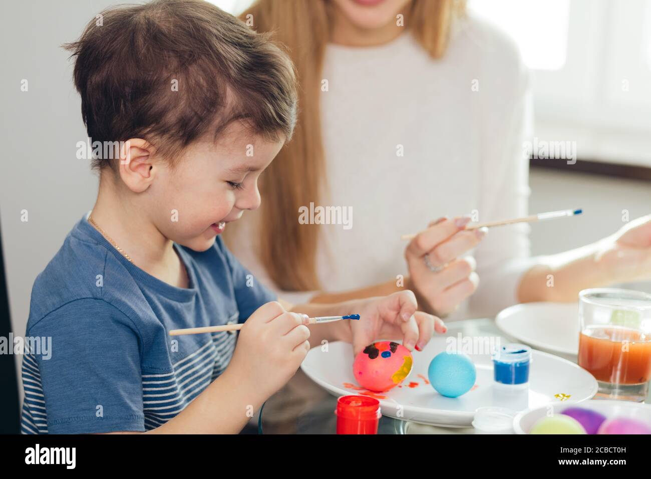 In Handcraft workshop for families, woman and male child. Learning new ...