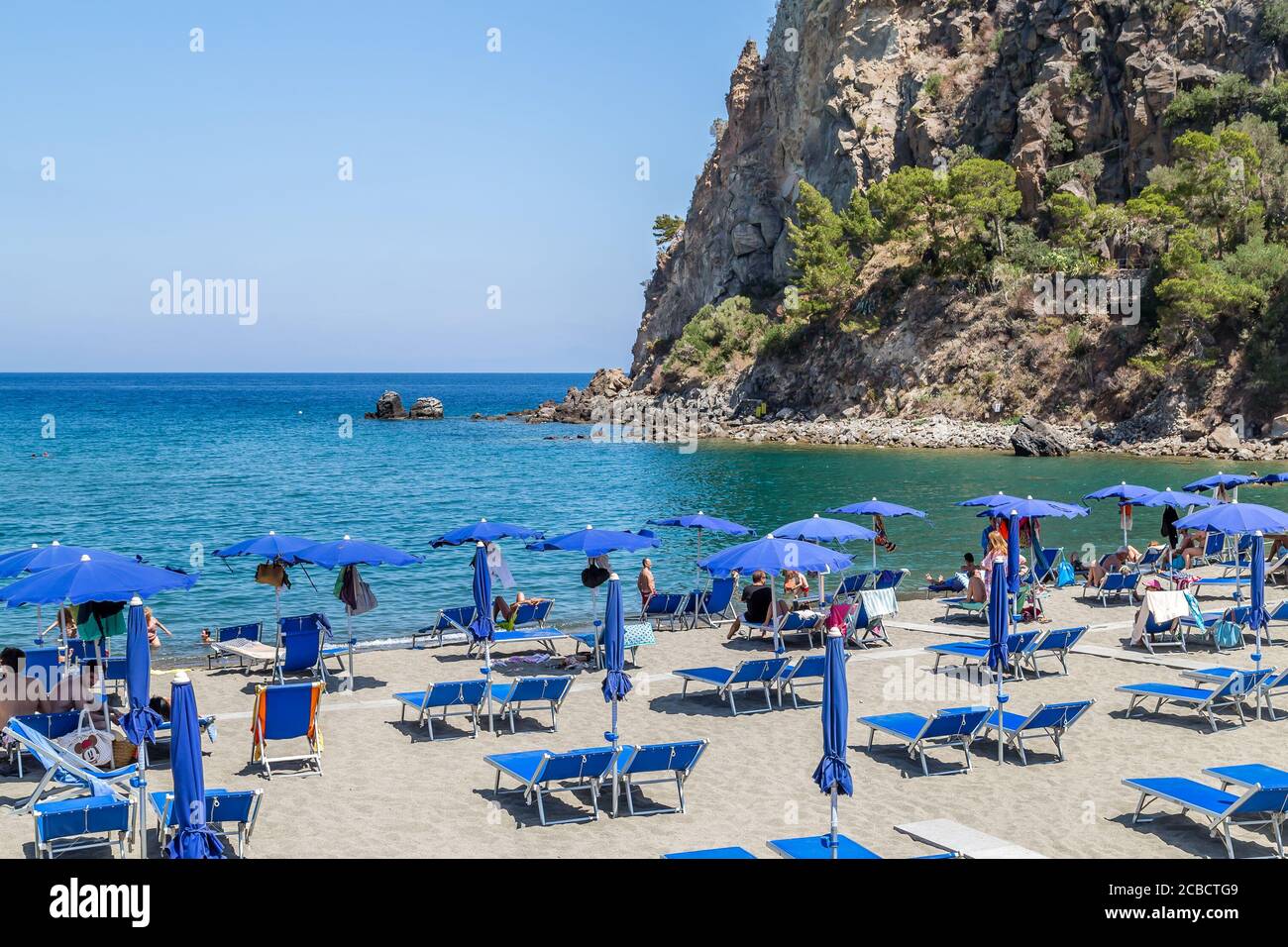 ISCHIA (NA), JUNE 29, 2020: tourists sunbathing and taking a swim in a ...