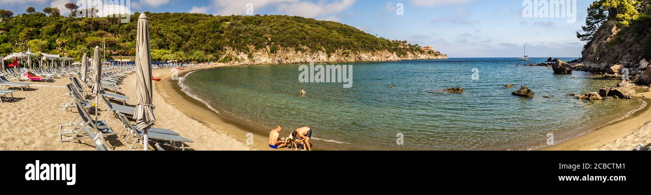 ISCHIA (NA), JUNE 29, 2020: tourists sunbathing and taking a swim in a ...