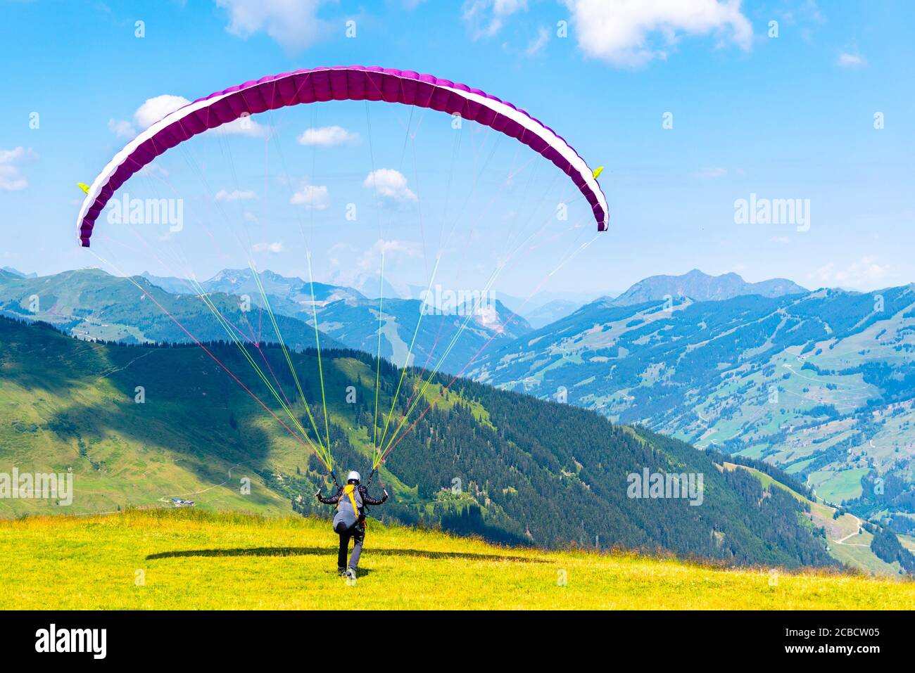 Paraglide launching. Starting procedure of paraglider on high mountain ...