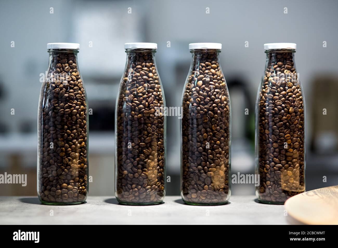 Glass transparent bottles filled with roasted coffee beans, transparent ...
