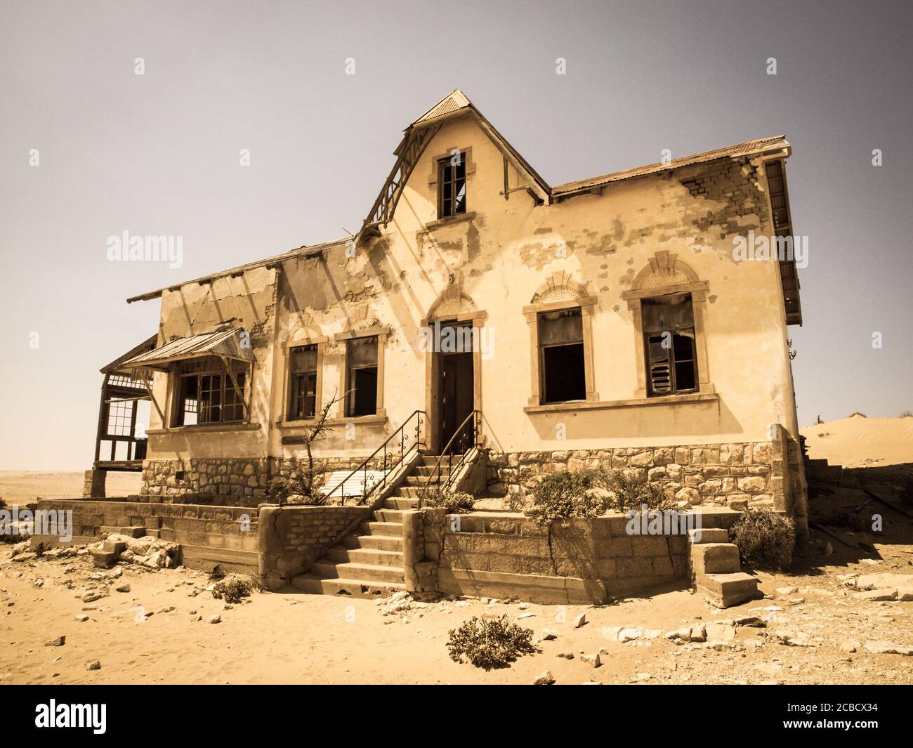 Ghost buildings of old diamond mining town Kolmanskop near Luderitz in ...
