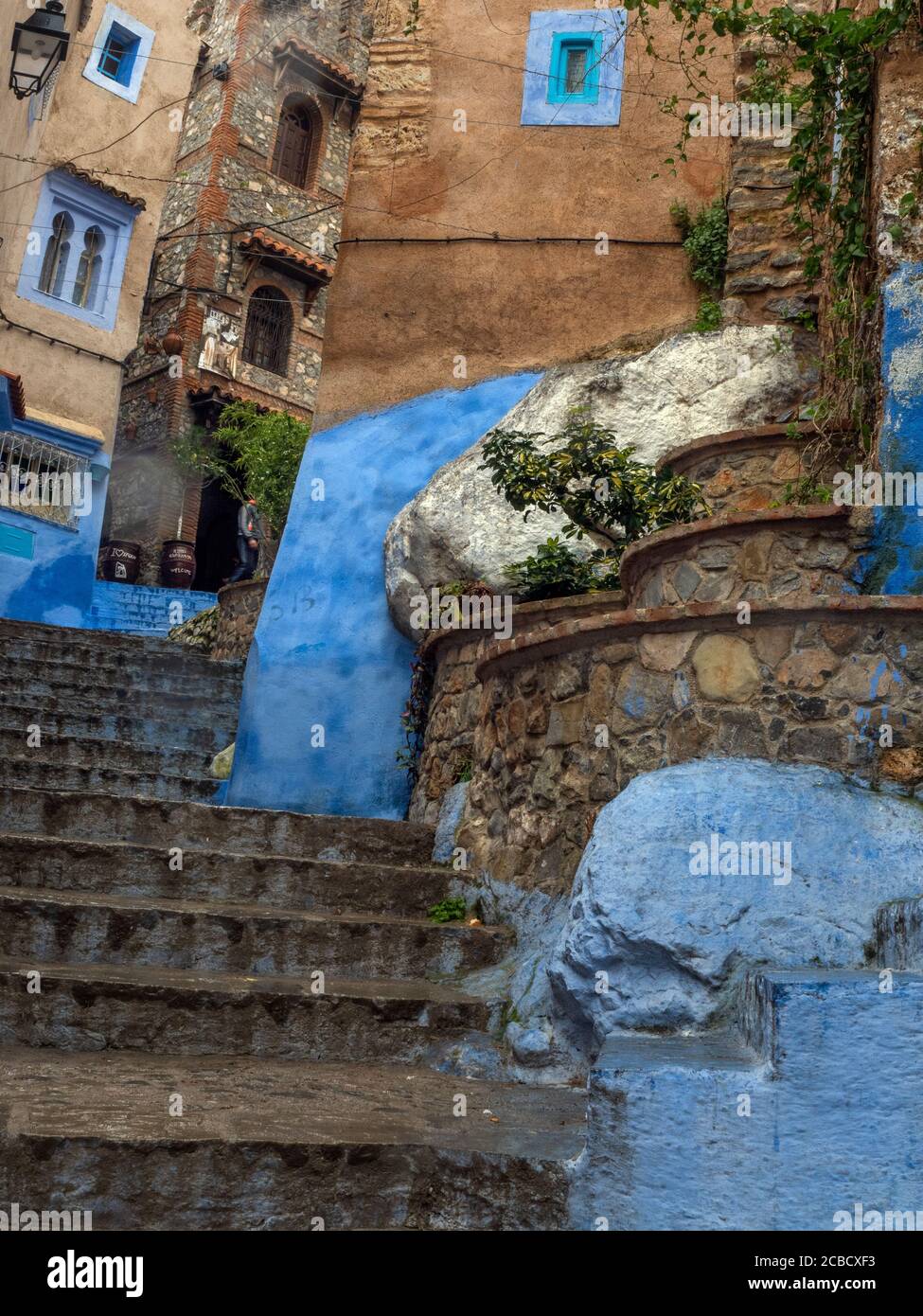 Steep steps to a narrow street in the medina of the ancient city of ...