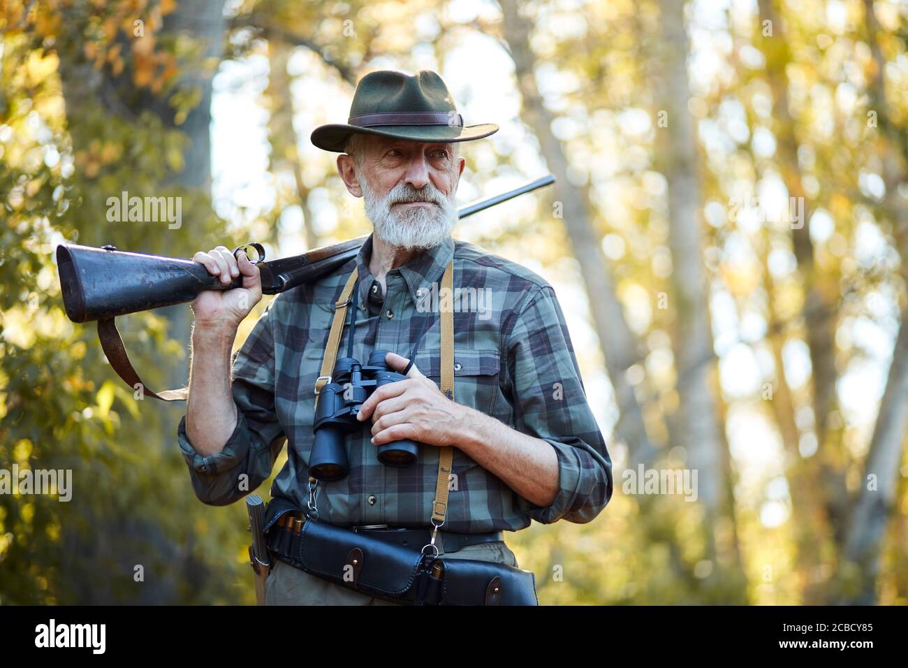 Holding gun on shoulder hi-res stock photography and images - Alamy