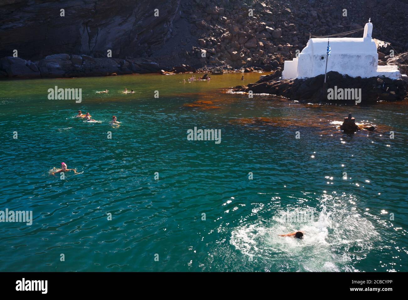 People bathing in thermal springs of Palia Kameni island, Greece Stock ...