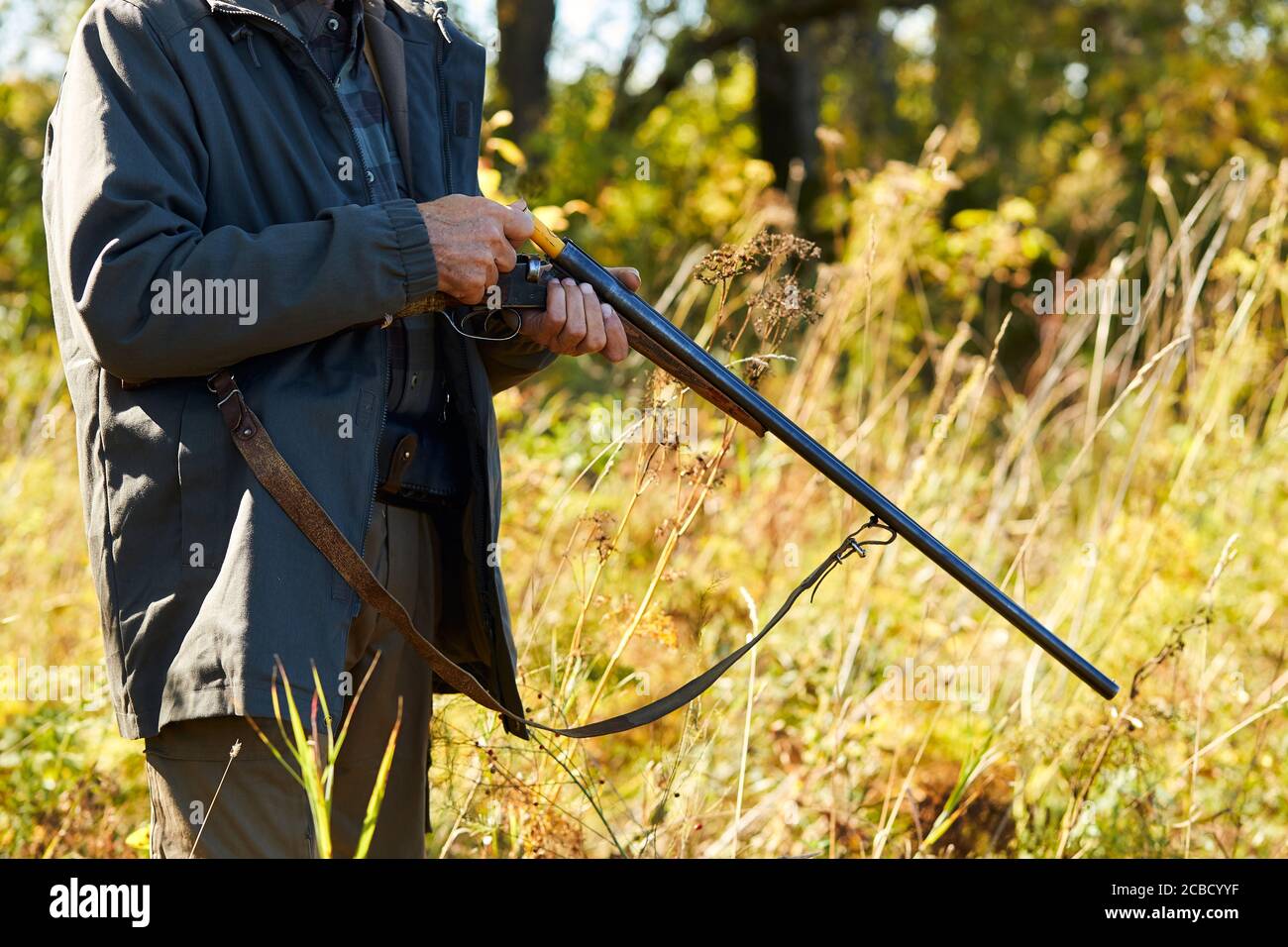 Hunter man load rifle, shotgun going to shoot on wild animals. Hunting ...