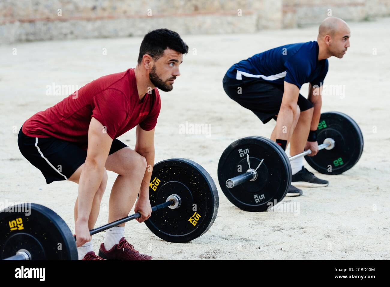 Two weightlifters lifting weights in an urban environment Stock Photo ...