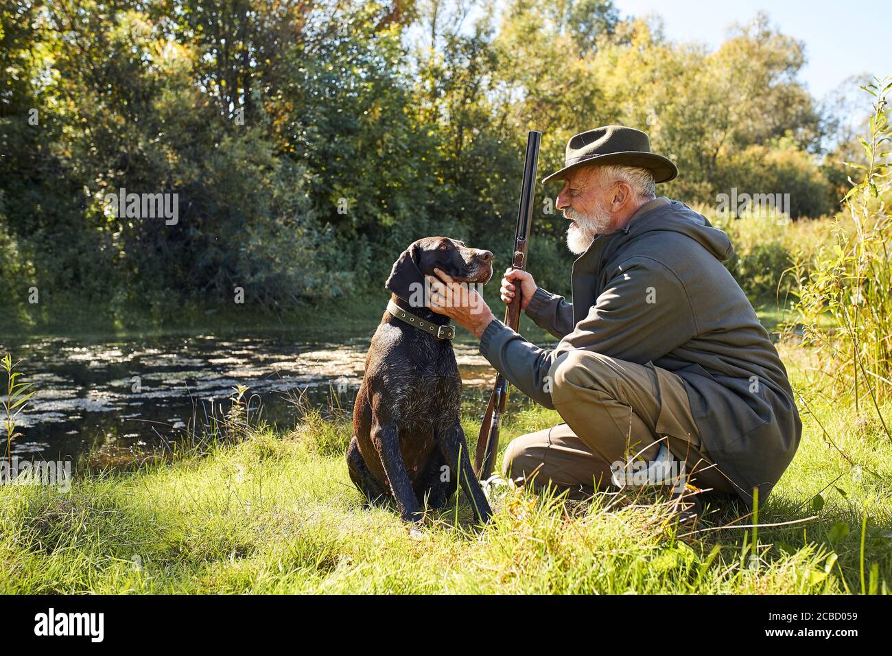 Resting after hunting. Good job, successful hunting on lake. Bearded ...