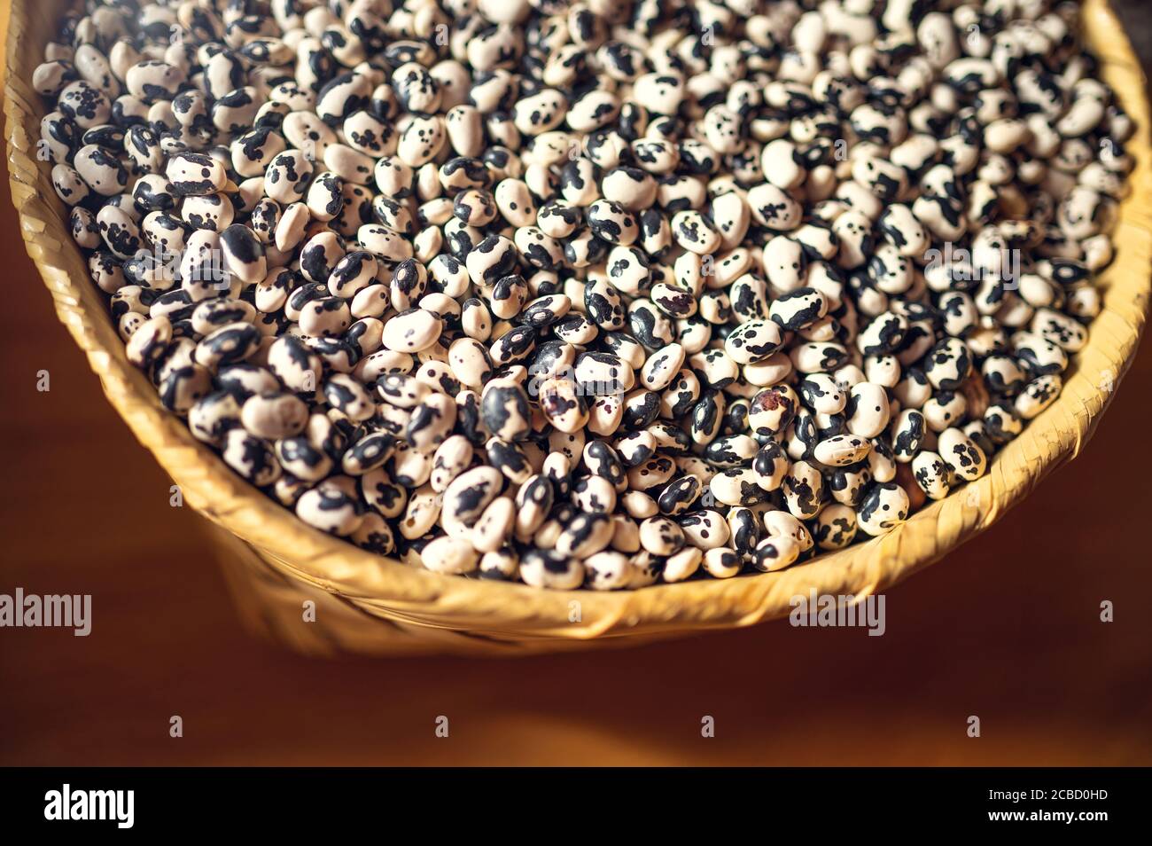 Exotic colorful mexican beans on wicker basket. Top view of legumes ...
