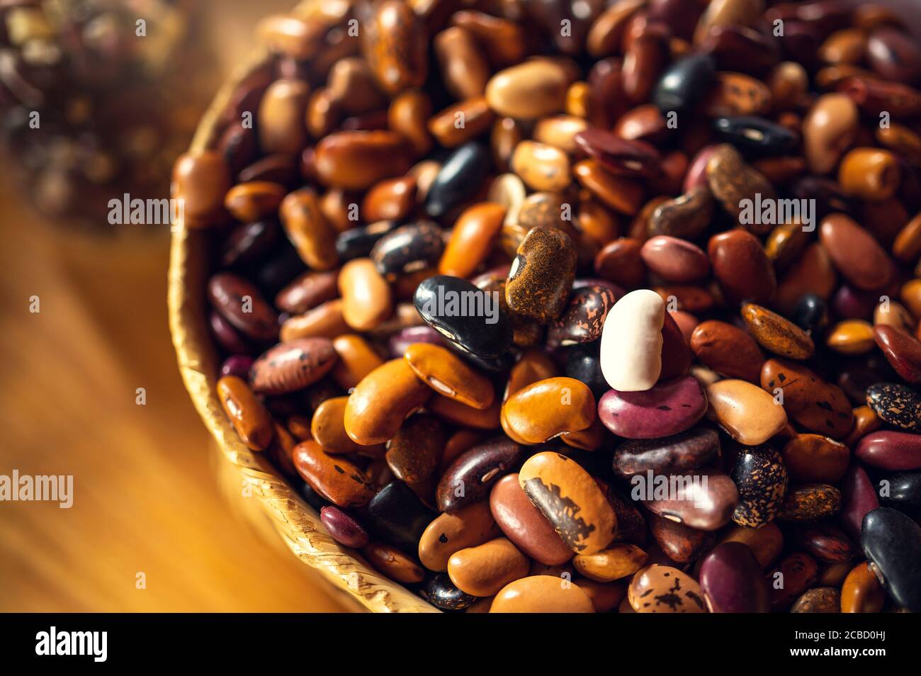 Exotic colorful mexican beans on wicker basket. Top view of legumes ...
