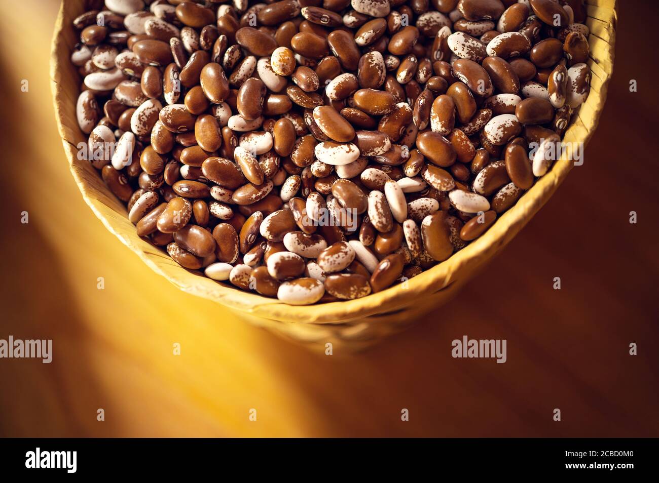 Exotic colorful mexican beans on wicker basket. Top view of legumes ...
