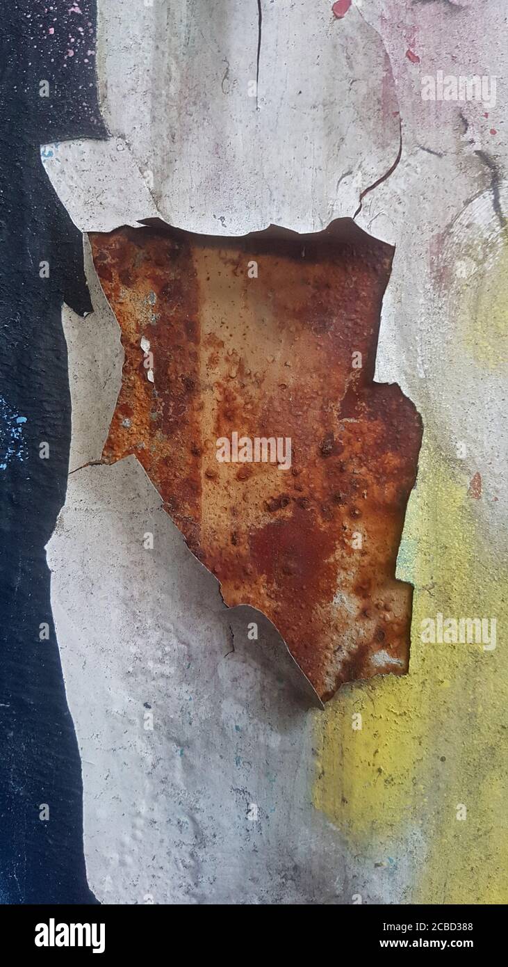 Old weathered paint that separated from rusty metal and peels off Stock ...