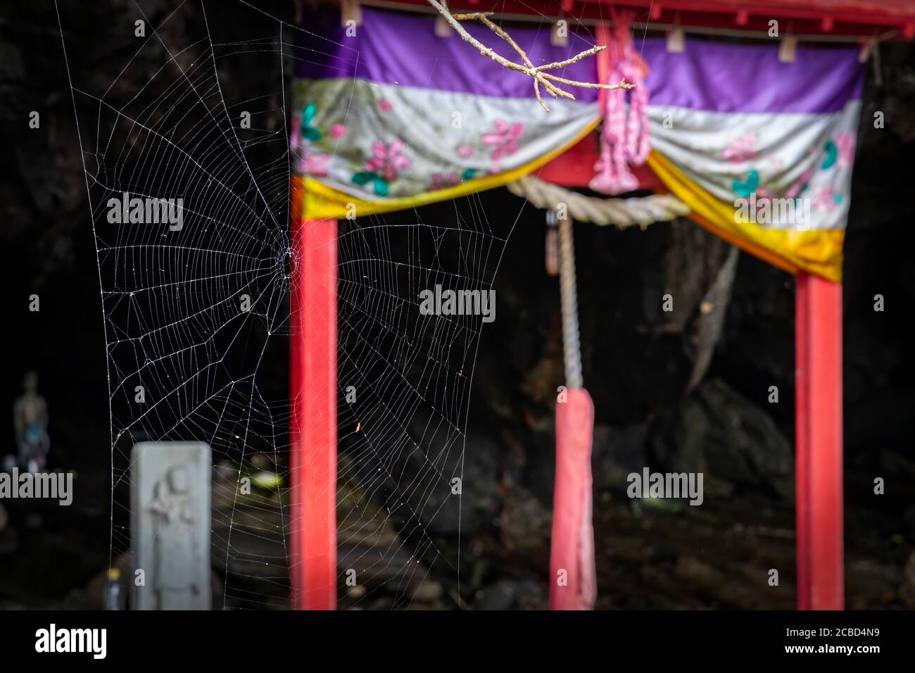 A spider web hangs near the entrance to the Kozakurakannon Shrine at ...