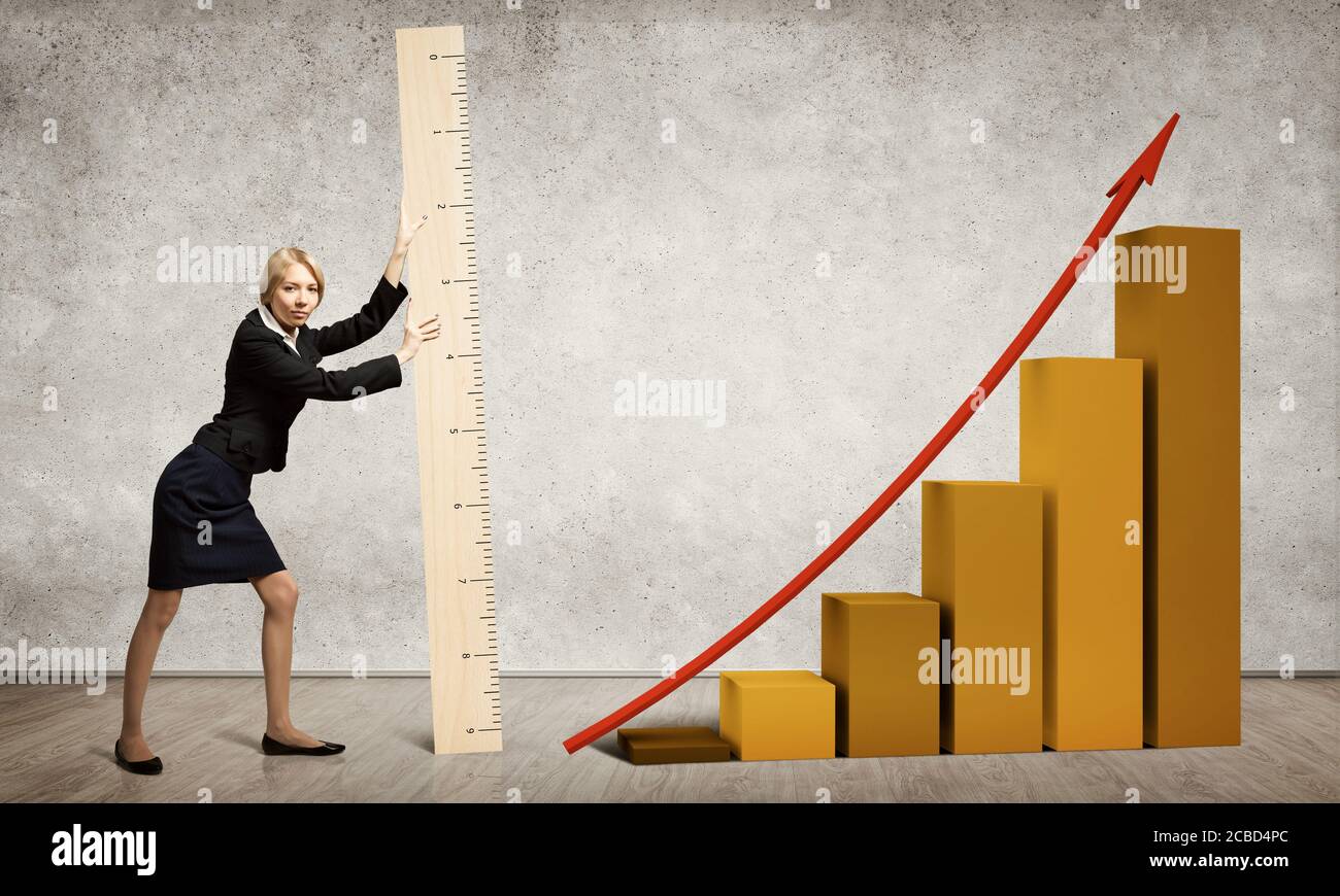 Woman with ruler Stock Photo - Alamy