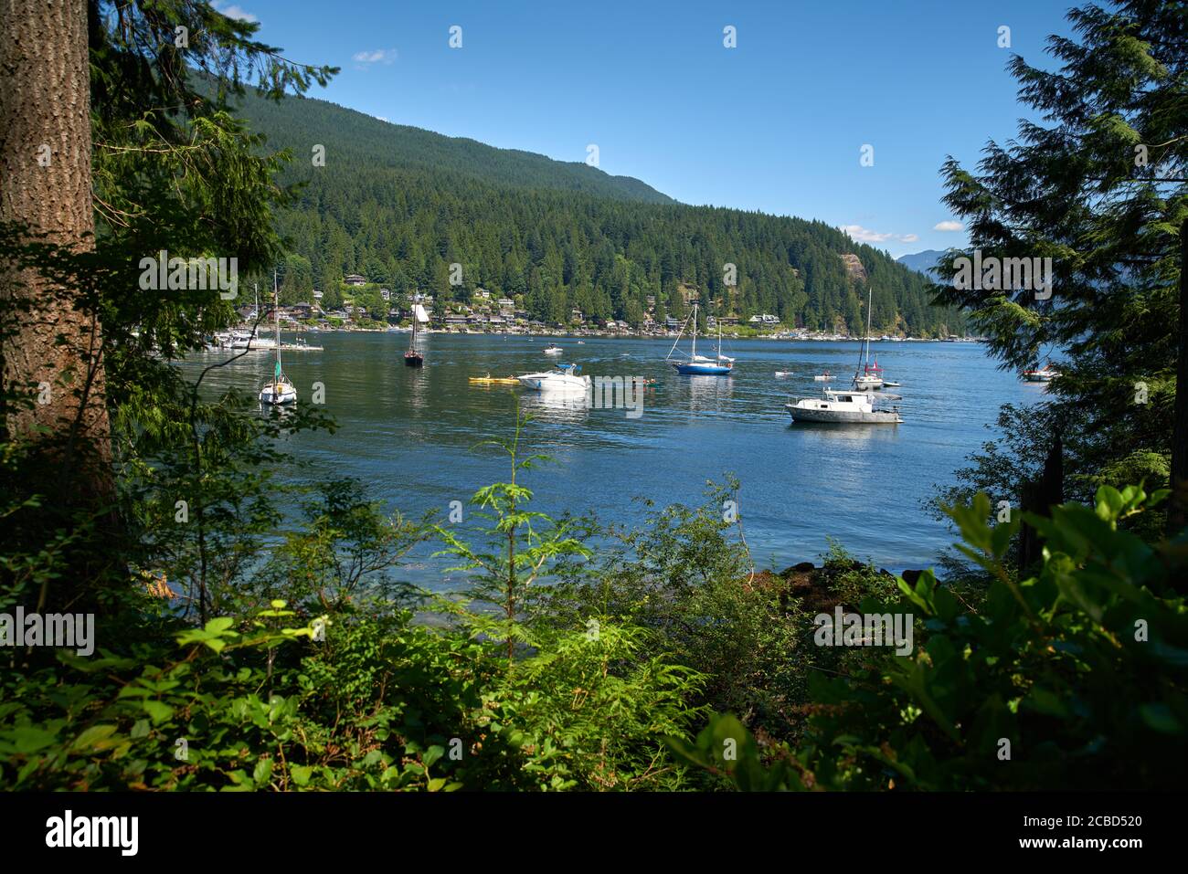 Deep Cove Summer Sports BC. Kayaks and canoes on the water in Deep Cove ...