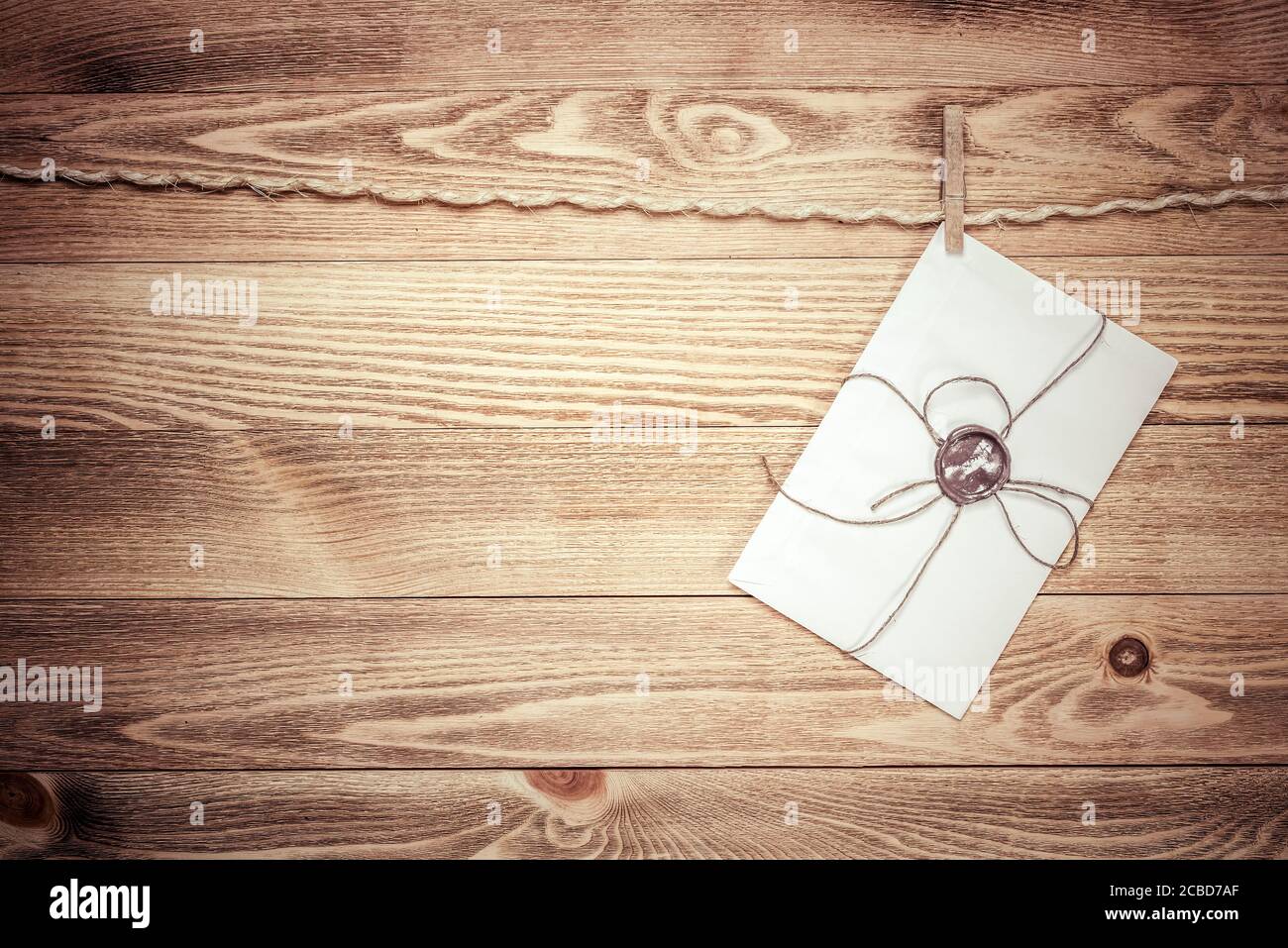 Mail envelope on rope Stock Photo - Alamy