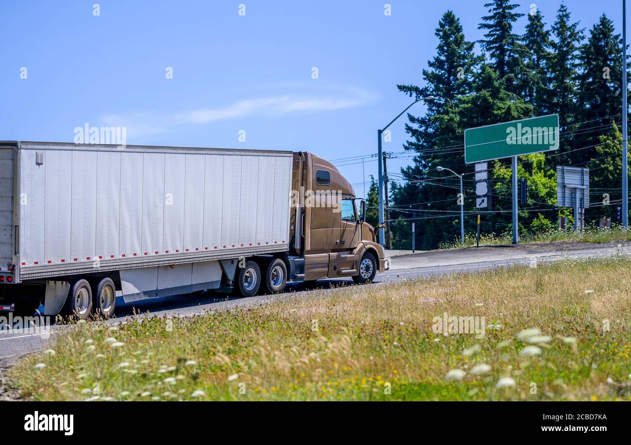 Big rig brown long haul bonnet diesel semi truck tractor transporting ...