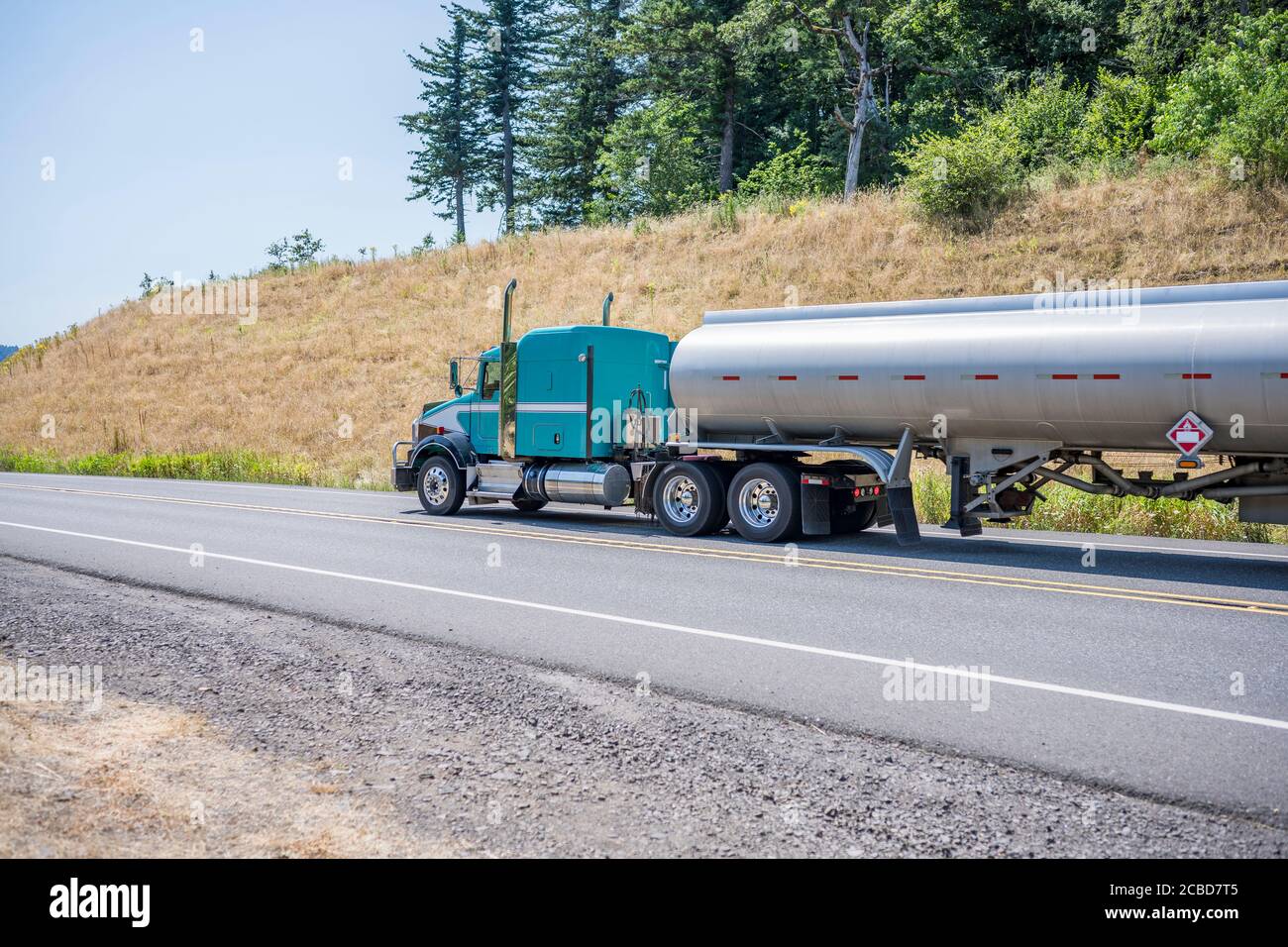 Loaded industrial green big rig semi truck with long cab for truck ...