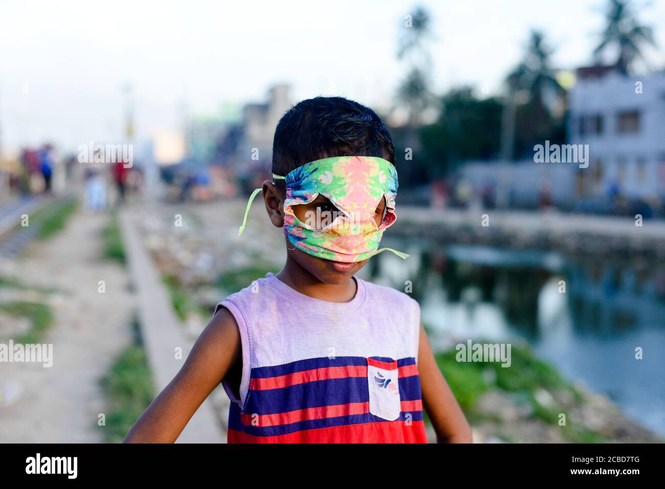 Dhaka, Bangladesh. 12th Aug, 2020. A kid wearing a fancy face mask.Dhaka is going back to its ...
