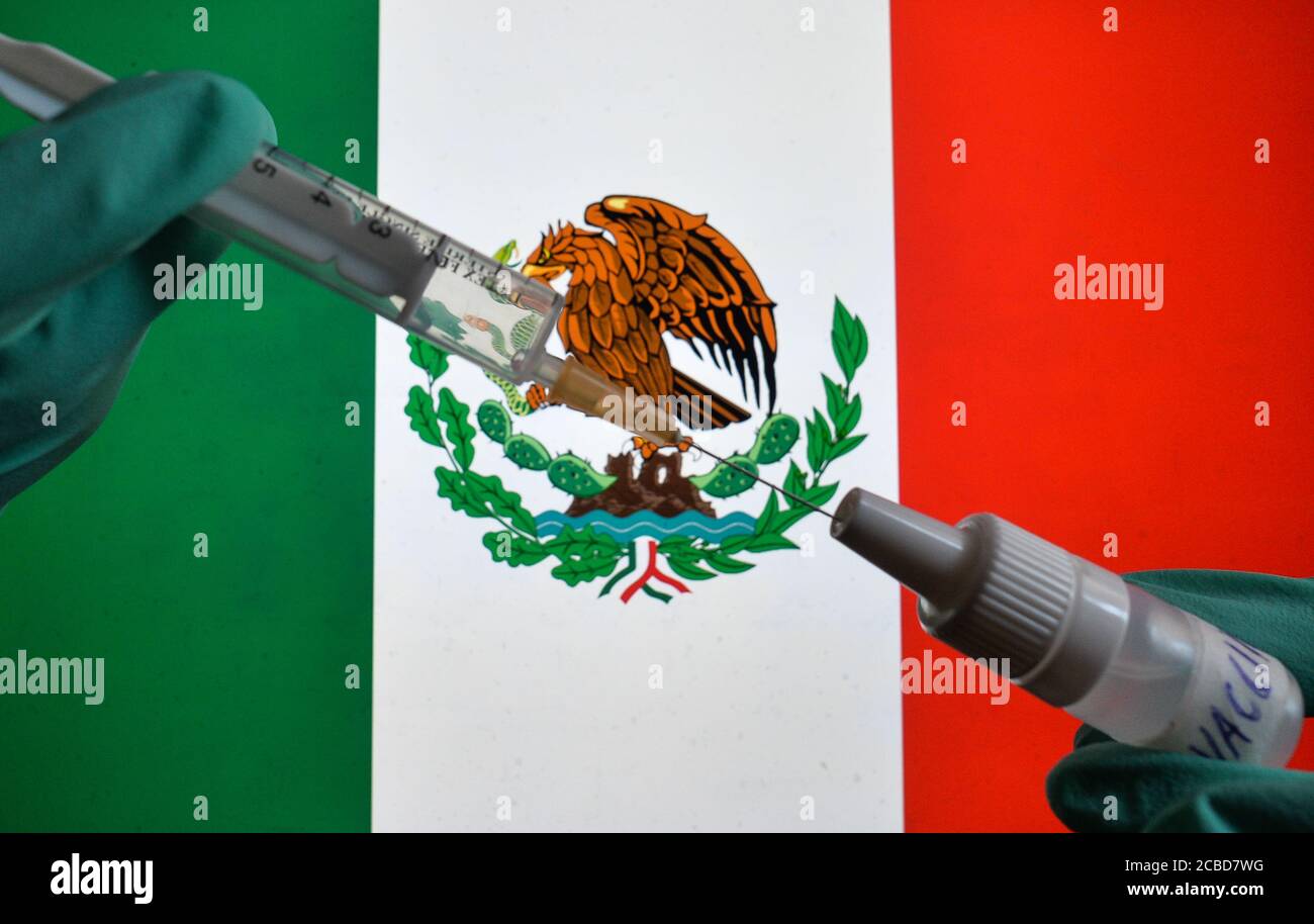 In this photo illustration a medical syringe and the Mexican flag in ...