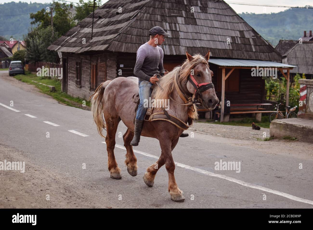 Maramures / Romania - August 28, 2019: Young blond Romanian man riding ...