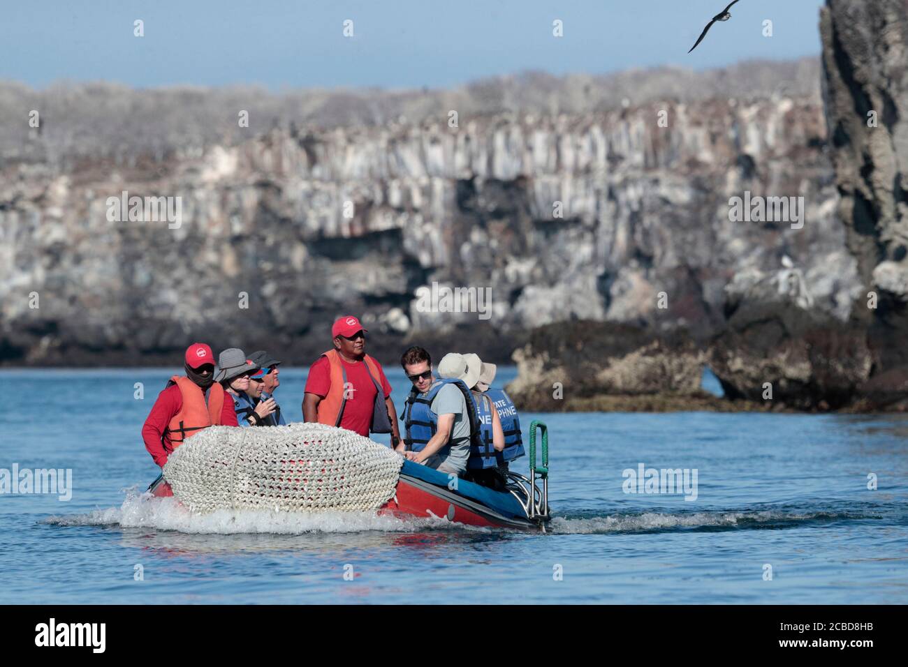 Tourists in Zodiac boat, near Prince Phillip Steps,Darwin Bay, Isla ...