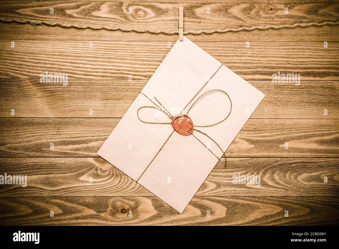 Mail envelope on rope Stock Photo - Alamy