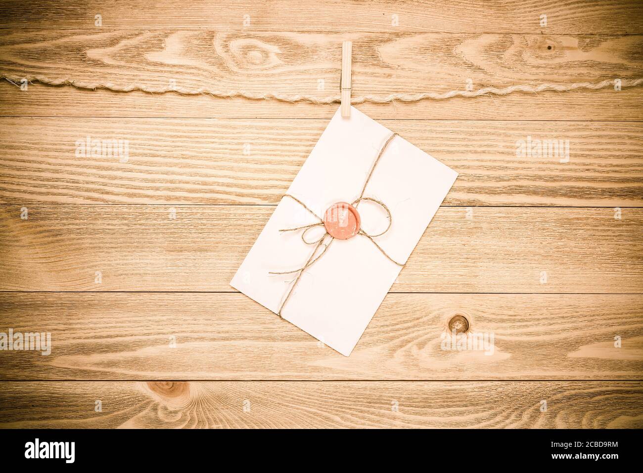 Mail envelope on rope Stock Photo - Alamy