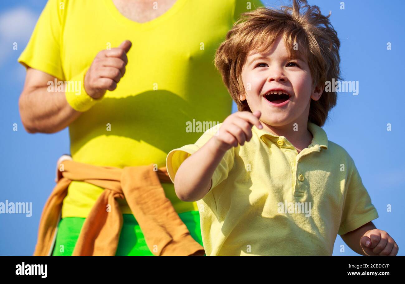 Healthy family concept. Father and son play sports and run. Healthy ...