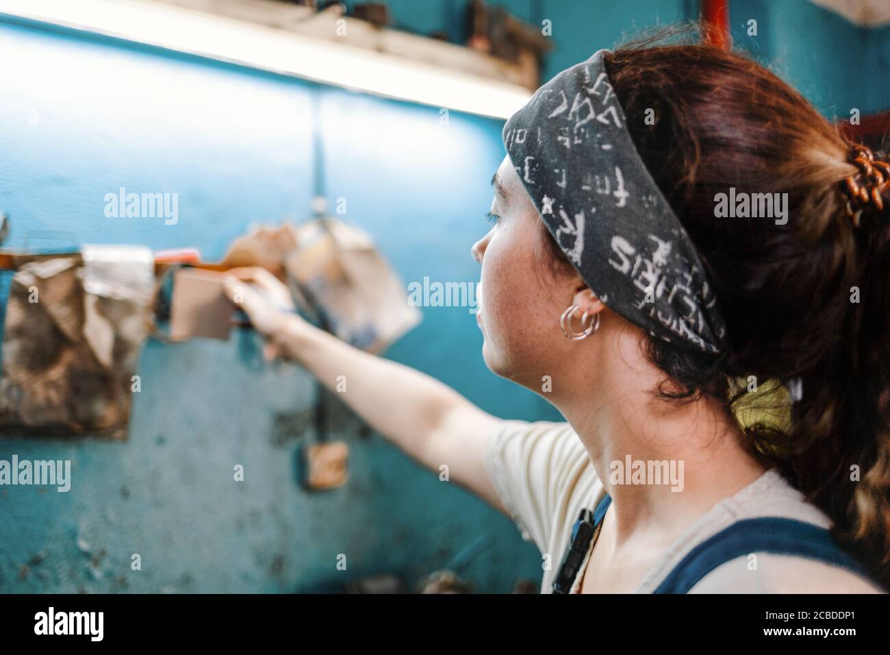 Gender equality. Portrait of a young woman in uniform working in a ...